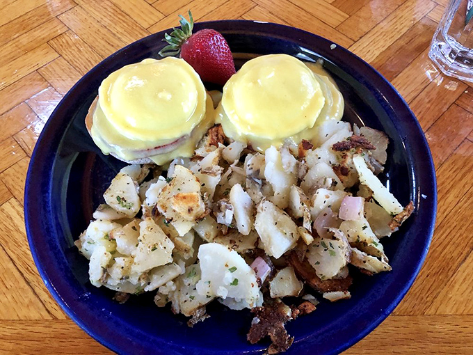 Eggs Benedict done right – perfectly poached eggs perched atop Canadian bacon, all swimming in hollandaise that's worth getting out of bed for.