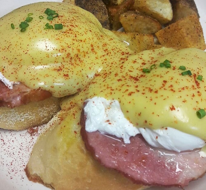 Eggs Benedict with ham that's been given the respect it deserves, topped with hollandaise that's clearly on speaking terms with fresh lemons.