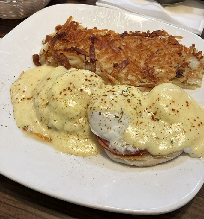 Eggs Benedict that would make a brunch enthusiast weep tears of hollandaise joy. Those hash browns deserve their own fan club.