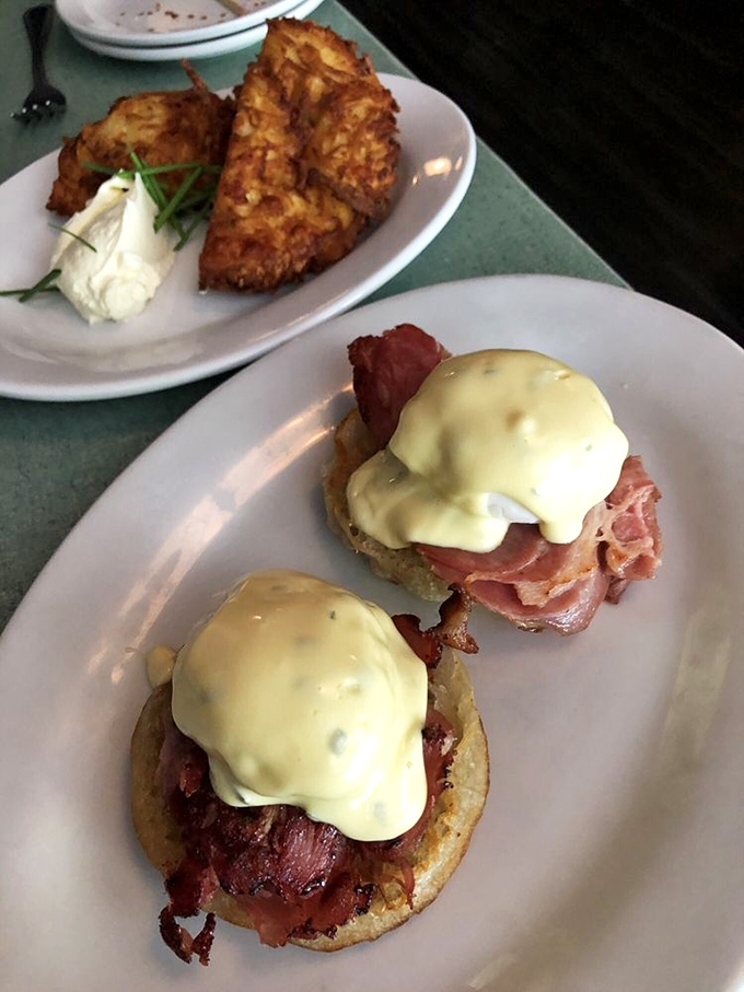 Brunch perfection: English muffins playing throne to perfectly cooked meat and hollandaise so good you'll want to bathe in it.
