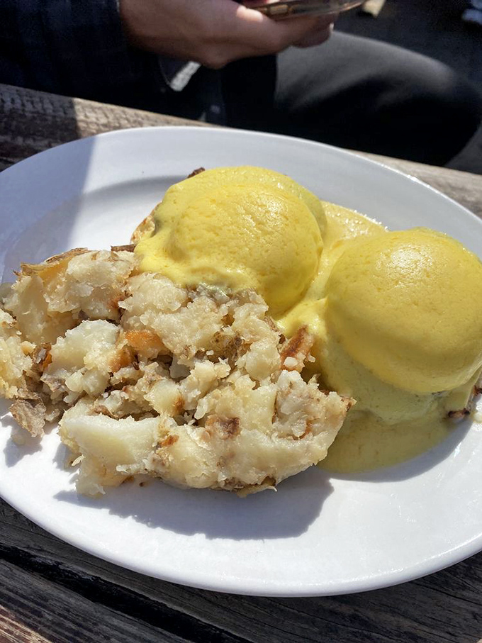 Eggs Benedict gets the coastal treatment here, where perfectly poached eggs meet crispy potatoes in a morning romance that would make Neptune himself jealous. 