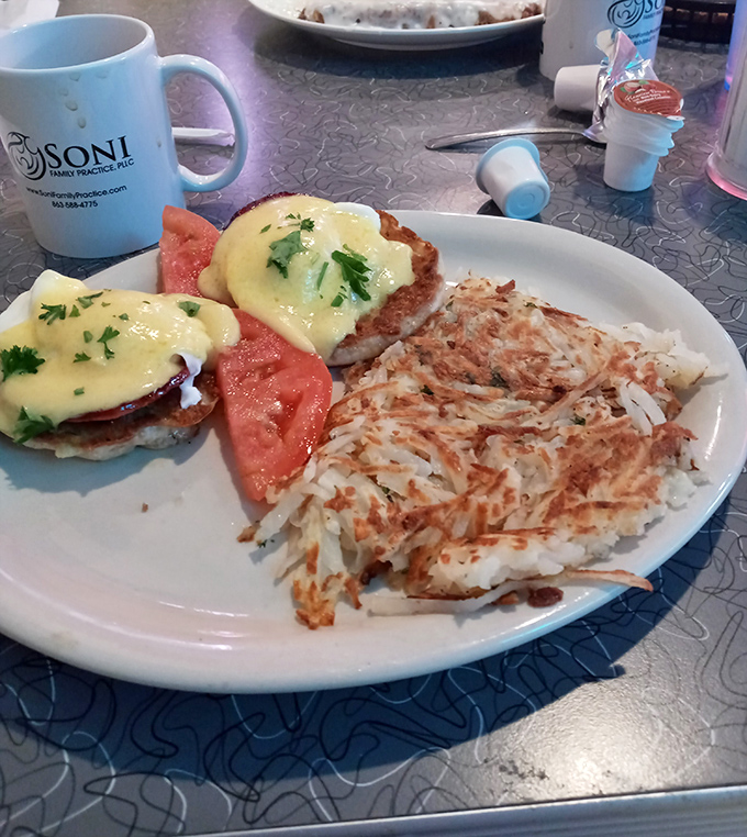 These eggs Benedict aren't just breakfast, they're architecture&mdash;perfectly poached eggs balancing on Canadian bacon with hollandaise cascading like a yellow waterfall.