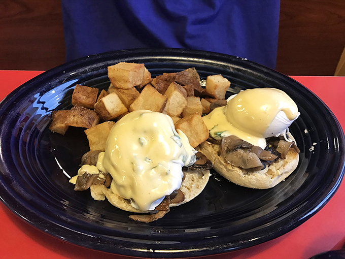 Eggs Benedict reimagined with mushrooms – hollandaise cascading down like a yellow waterfall of buttery goodness.