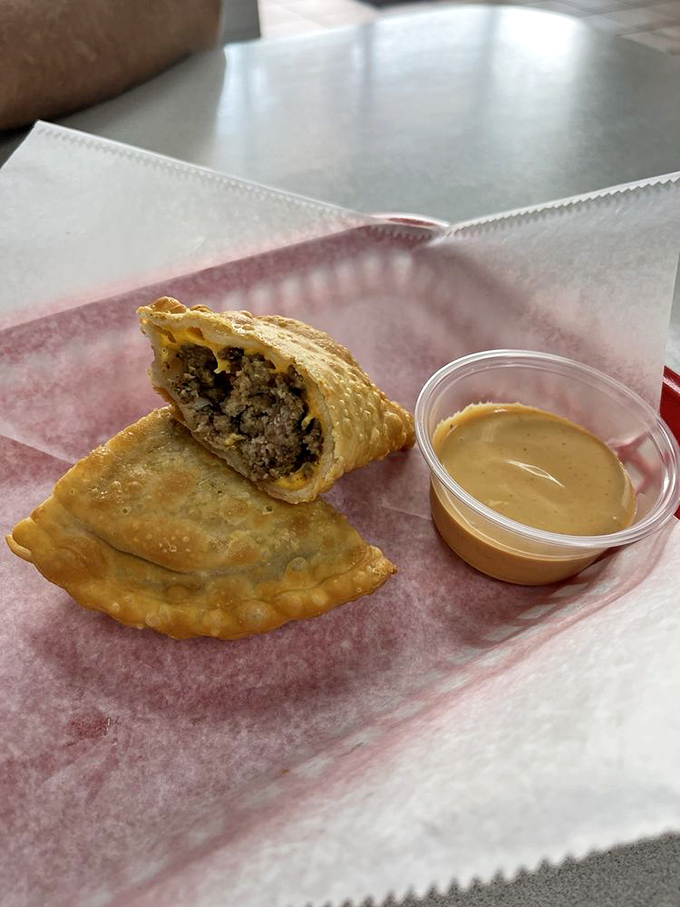 Golden empanadas with that perfect crimped edge&mdash;like little treasure chests filled with savory goodness instead of doubloons. The dipping sauce is non-negotiable.