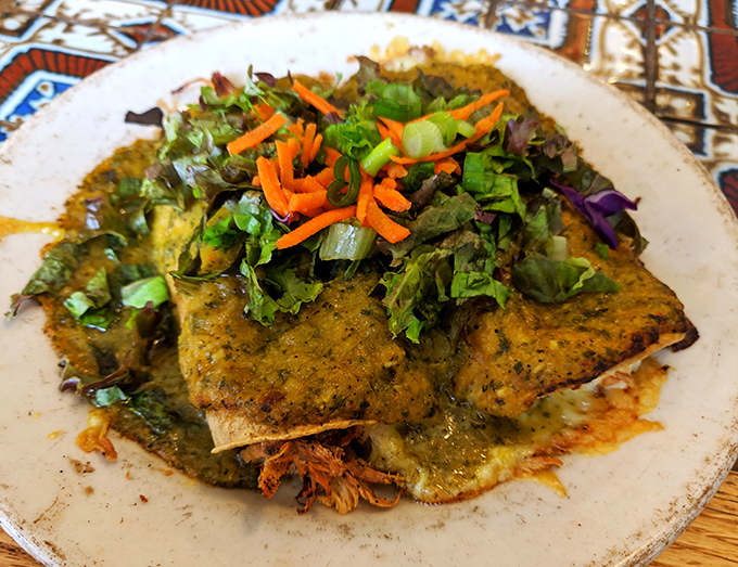 Enchiladas verde swimming in that gorgeous green sauce &ndash; this is what culinary dreams are made of, folks.