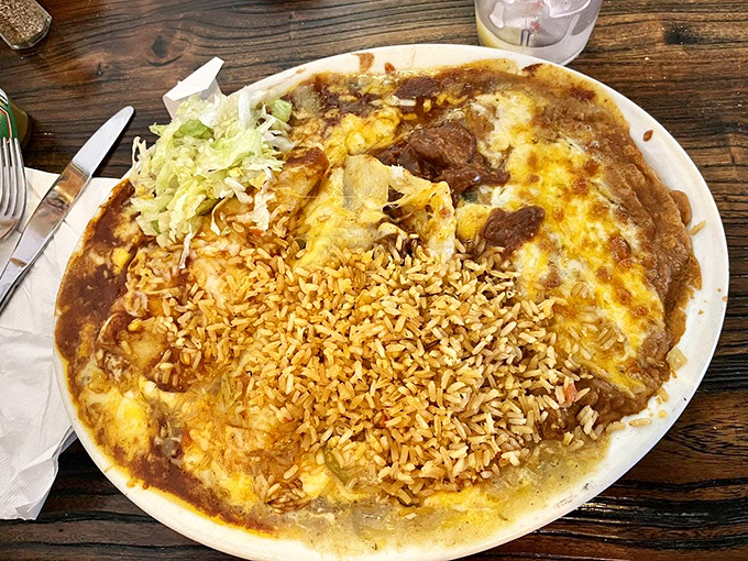Enchiladas swimming in sauce with a life raft of rice&mdash;the kind of plate that makes you want to cancel your afternoon plans.