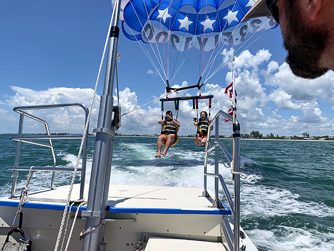 Parasailing over Englewood waters: all the thrill of flying without the TSA pat-down or overpriced airport coffee.