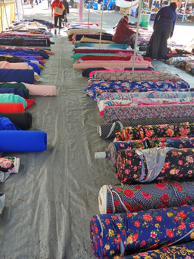 Fabric heaven stretches endlessly, making Martha Stewart's craft room look positively modest by comparison here.