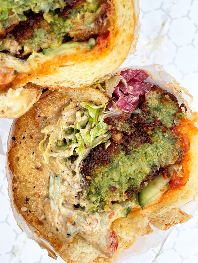 Vegetarians rejoice! This isn't some sad afterthought—it's a proper falafel creation with enough flavor to make even dedicated carnivores consider switching teams.