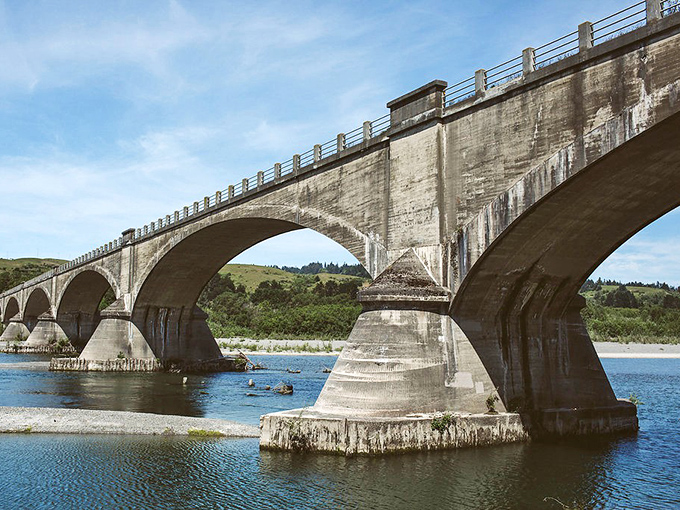 The historic Fernbridge spans the Eel River like a concrete poem&mdash;each arch a stanza connecting Ferndale to the modern world.