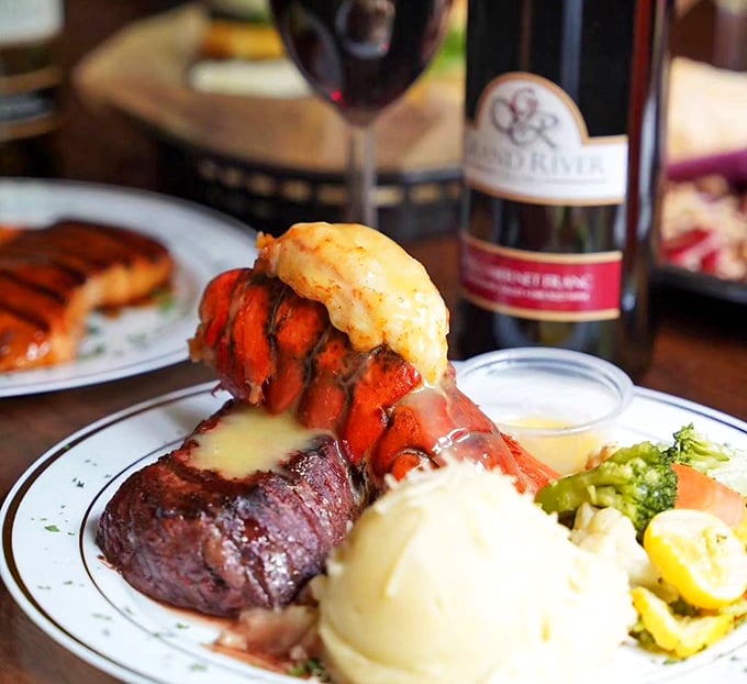 Surf meets turf in this showstopping entrée. That lobster tail isn't just riding shotgun—it's co-piloting a flavor adventure worth every bite.