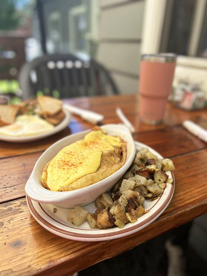 Morning magic on a plate&mdash;a delicate crepe filled with savory goodness, paired with those legendary home fries that could make a potato farmer weep with joy.