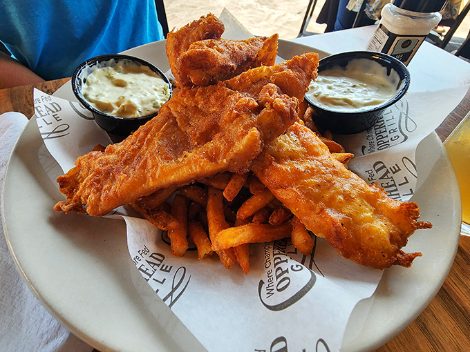 Fish and chips that would make a British pub regular nod in approval. The golden batter crackles just by looking at it&mdash;no passport required.