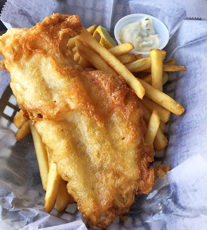 Fish and chips that would make a British pub jealous. That golden batter shatters like childhood dreams when your fork hits it.
