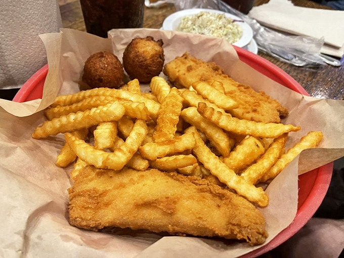 Fish and chips done right &ndash; crispy exterior, flaky interior, and those crinkle-cut fries that somehow taste better than regular ones.