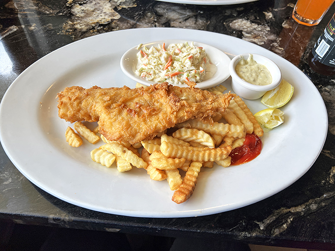Golden-battered fish that crunches like autumn leaves, paired with perfectly crisp fries. The coleslaw adds that refreshing counterpoint.
