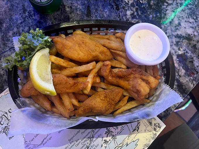 Fish and chips that would make a British pub jealous. Golden, crispy perfection with a squeeze of lemon waiting to brighten the whole affair.