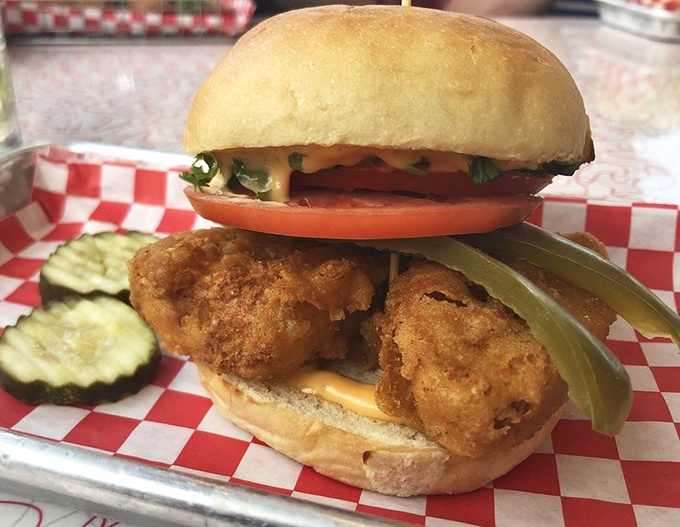 The fried fish sandwich that could convert seafood skeptics. Golden, crispy perfection nestled in a soft bun with just enough greenery to count as "balanced."