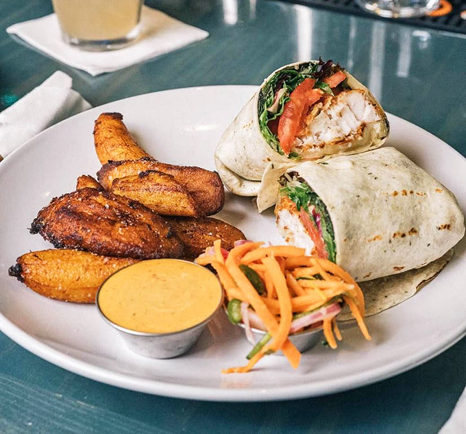 The fish wrap comes with plantain fries that will make you question why regular potatoes get all the attention in the french fry universe.