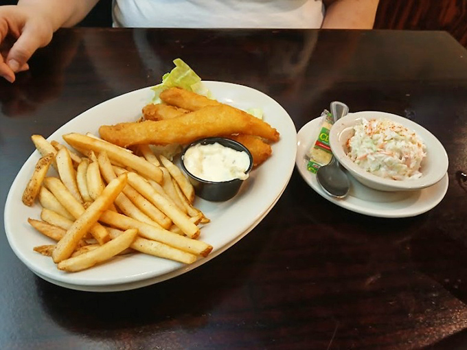 Golden fish and chips with creamy coleslaw&mdash;proof that sometimes the simplest pleasures are the most satisfying. Just listen to that perfect crunch!