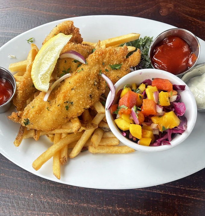 Crispy fish and chips with mango salsa—because sometimes the classics deserve a California makeover that actually improves the original.
