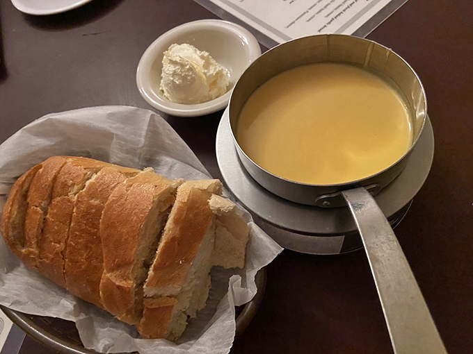 The cheese fondue arrives like liquid gold, with fresh sourdough standing by for dipping duty. It's the appetizer equivalent of a warm hug from your favorite aunt.