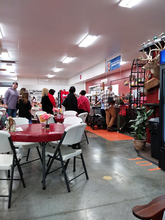 Where shopping meets sustenance&mdash;red tables invite weary bargain hunters to refuel before diving back into the marketplace madness.