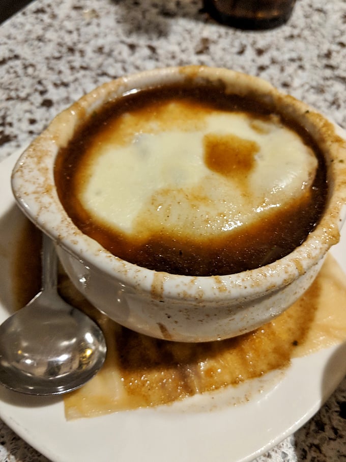 French onion soup that makes you understand why people write songs about love. That cheese pull deserves its own Instagram account.