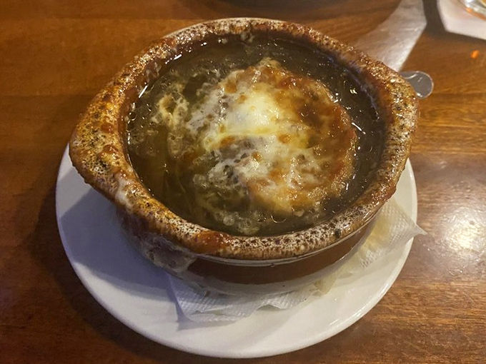 French onion soup that's achieved the holy grail: the perfect cheese-to-broth ratio with that irresistible crown of bubbling, browned goodness.