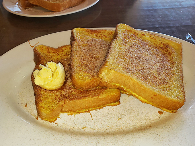 French toast so perfectly golden and cinnamon-dusted, it makes you wonder if your grandmother snuck into the kitchen when no one was looking.