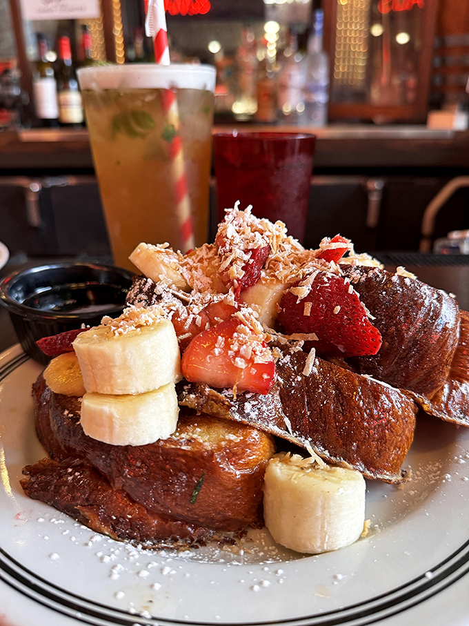 French toast that's dressed for success with fresh fruit, powdered sugar, and enough decadence to make breakfast feel like getting away with something.