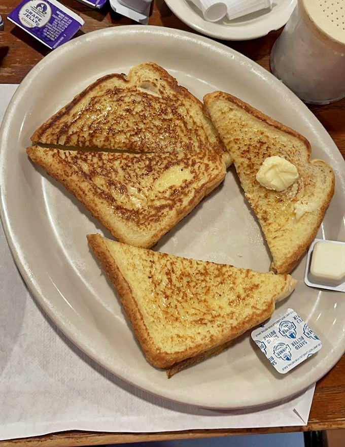 Golden-brown French toast that makes you question why anyone bothers with fancy brunch spots. Simple perfection needs no filter.