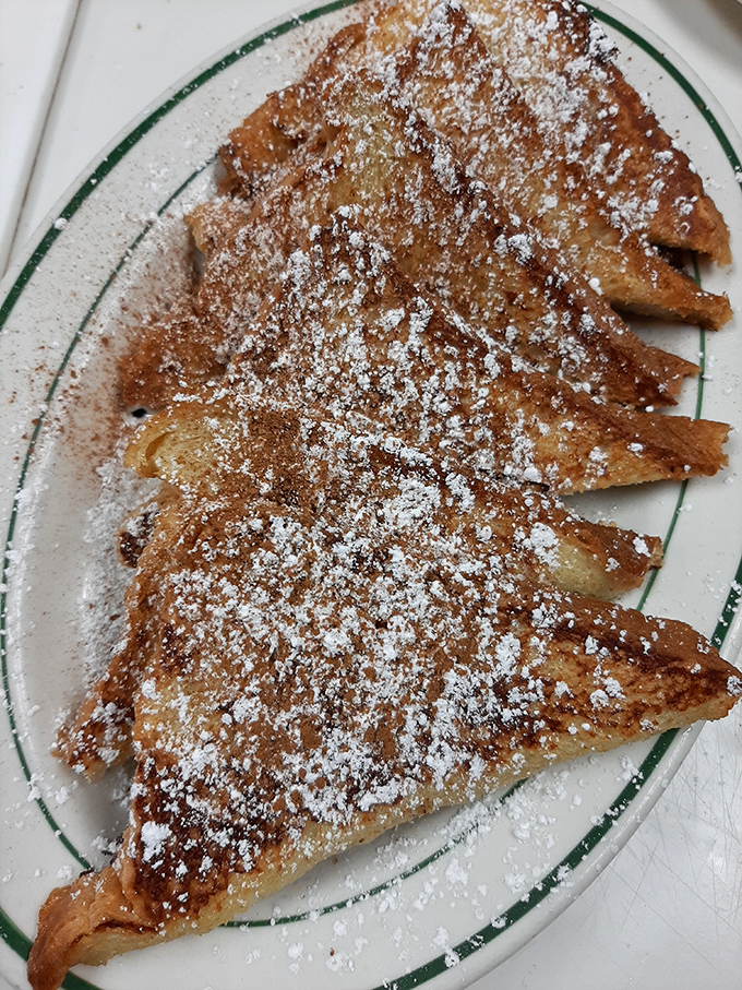 French toast dusted with powdered sugar like the first perfect snowfall of winter. Simple pleasures that remind you why breakfast will always be the superior meal.