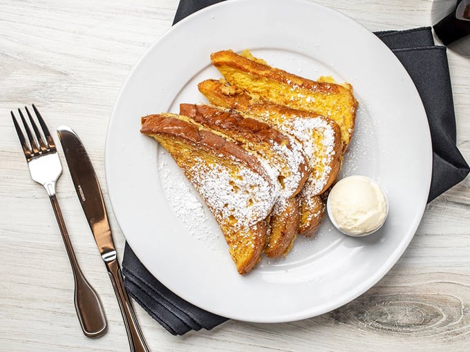 French toast so golden it could win an Oscar, dusted with powdered sugar like fresh California snow.