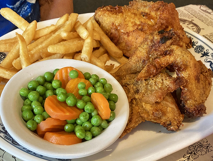 Fried chicken that would make your grandmother both jealous and proud, paired with fries that deserve their own fan club.