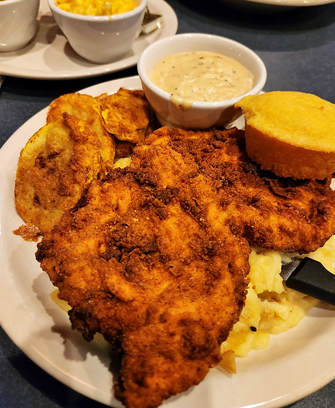 Southern fried chicken done right—a crackling exterior giving way to juicy meat, with sides that don't know they're supposed to be supporting actors.