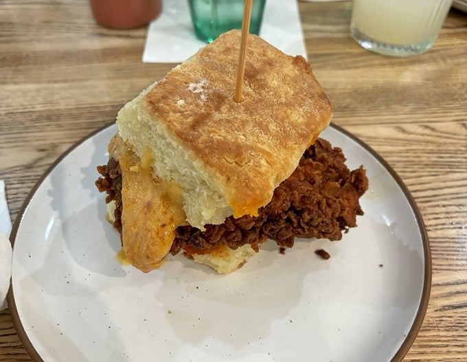 This isn't just a sandwich&mdash;it's an architectural masterpiece of tender meat and flaky biscuit that demands to be photographed before it's devoured.