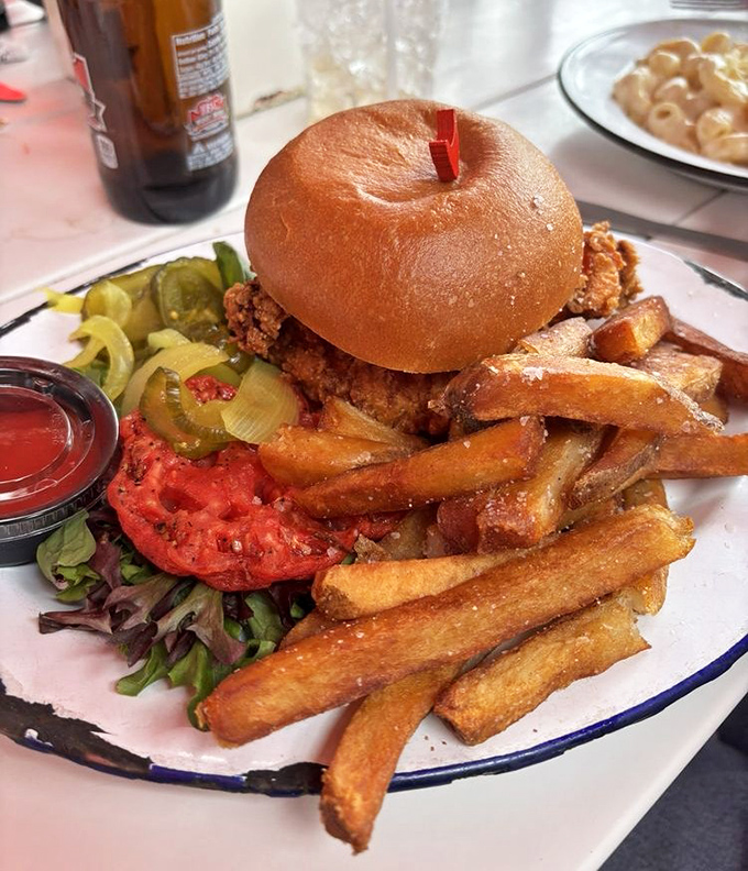 This isn't just a sandwich&mdash;it's an engineering marvel of crispy chicken, fresh veggies, and golden fries that would make any lunch hour memorable.