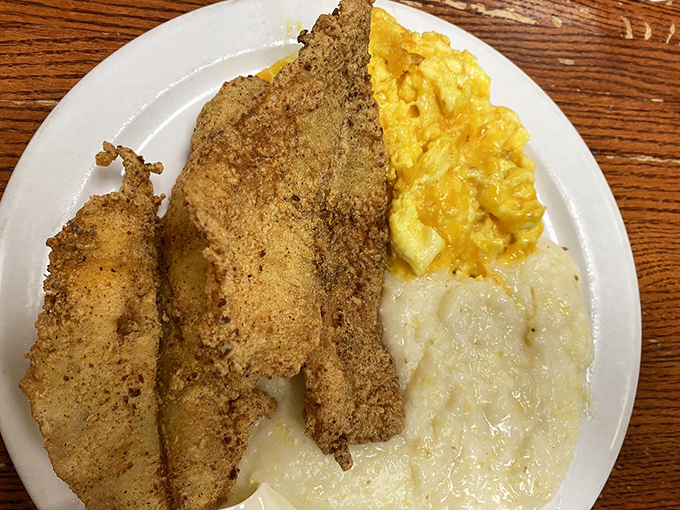 Fish for breakfast? Absolutely! This cornmeal-crusted masterpiece with grits proves that morning meals don't have to follow arbitrary rules.