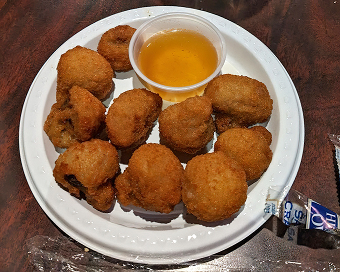 Golden-fried mushrooms with dipping sauce&mdash;proof that vegetables can be just as deliciously sinful as anything else on the menu.