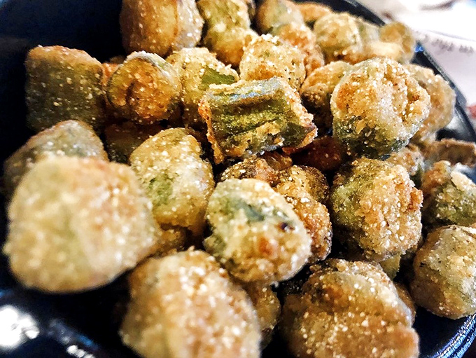 Fried okra that defies the vegetable's slimy reputation. These golden nuggets convert okra skeptics faster than a Southern preacher on Sunday.