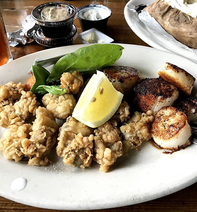The perfect marriage: golden-fried oysters meet seared scallops on a plate. Like Neptune himself arranged this oceanic blind date.