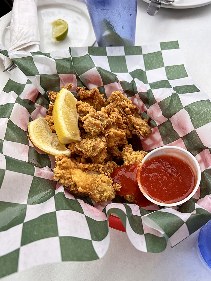 Crispy, golden-fried oysters served with a wedge of lemon and dipping sauce. These little flavor bombs are the ocean's perfect bite-sized gift.