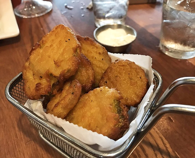 Golden-fried pickle chips that deliver that perfect pucker-crunch combination. Like potato chips with a PhD in flavor complexity.