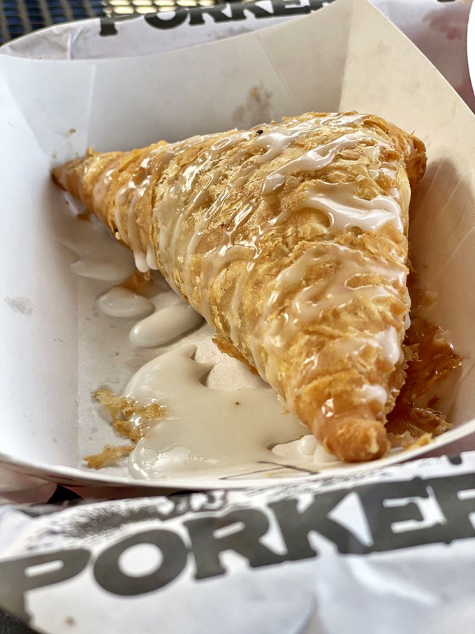 This isn't just dessert&mdash;it's a fried pie with glaze cascading down its flaky armor, ready to ambush your diet plans with sweet, sweet treachery.