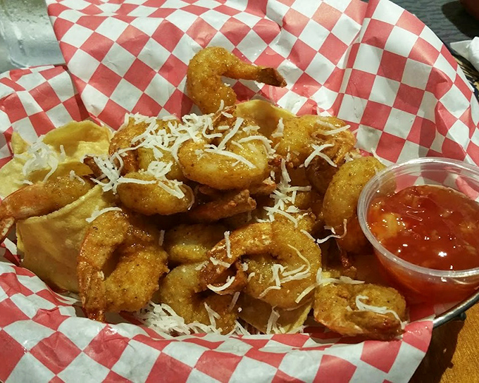 Golden-fried shrimp that crunch like autumn leaves, served in a checkered basket that whispers, "Yes, this is exactly what you've been craving."