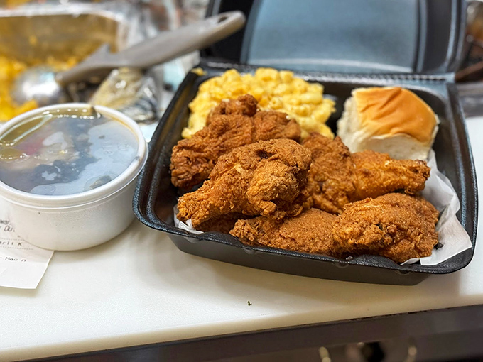Golden-armored chicken, mac and cheese that's practically glowing, and a roll that's just waiting to sop up every last bit of goodness.