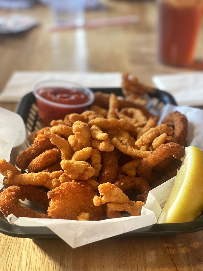 Crispy treasures from Neptune's pantry. These golden-fried clams and calamari are what seafood dreams are made of&mdash;just add that tangy dipping sauce!