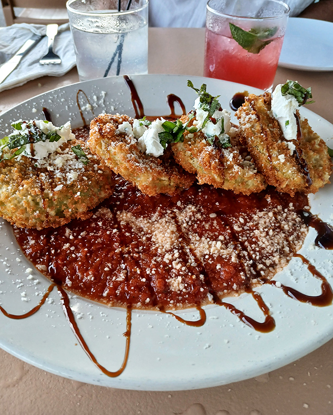 Fried green tomatoes dressed up fancy, proving vegetables can party just as hard as seafood.