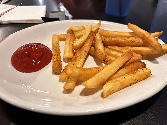 Golden, crispy, seasoned fries that deserve their own spotlight. These aren't mere side dishes&mdash;they're supporting actors stealing scenes from the main attraction.